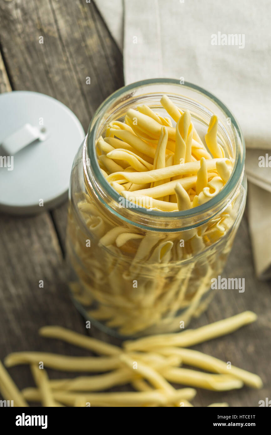 Raw italian pasta in jar Stock Photo - Alamy