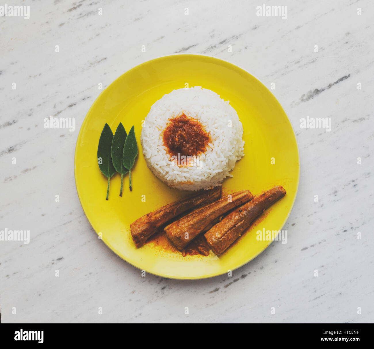 Plate with rise and fish on marble background Stock Photo - Alamy