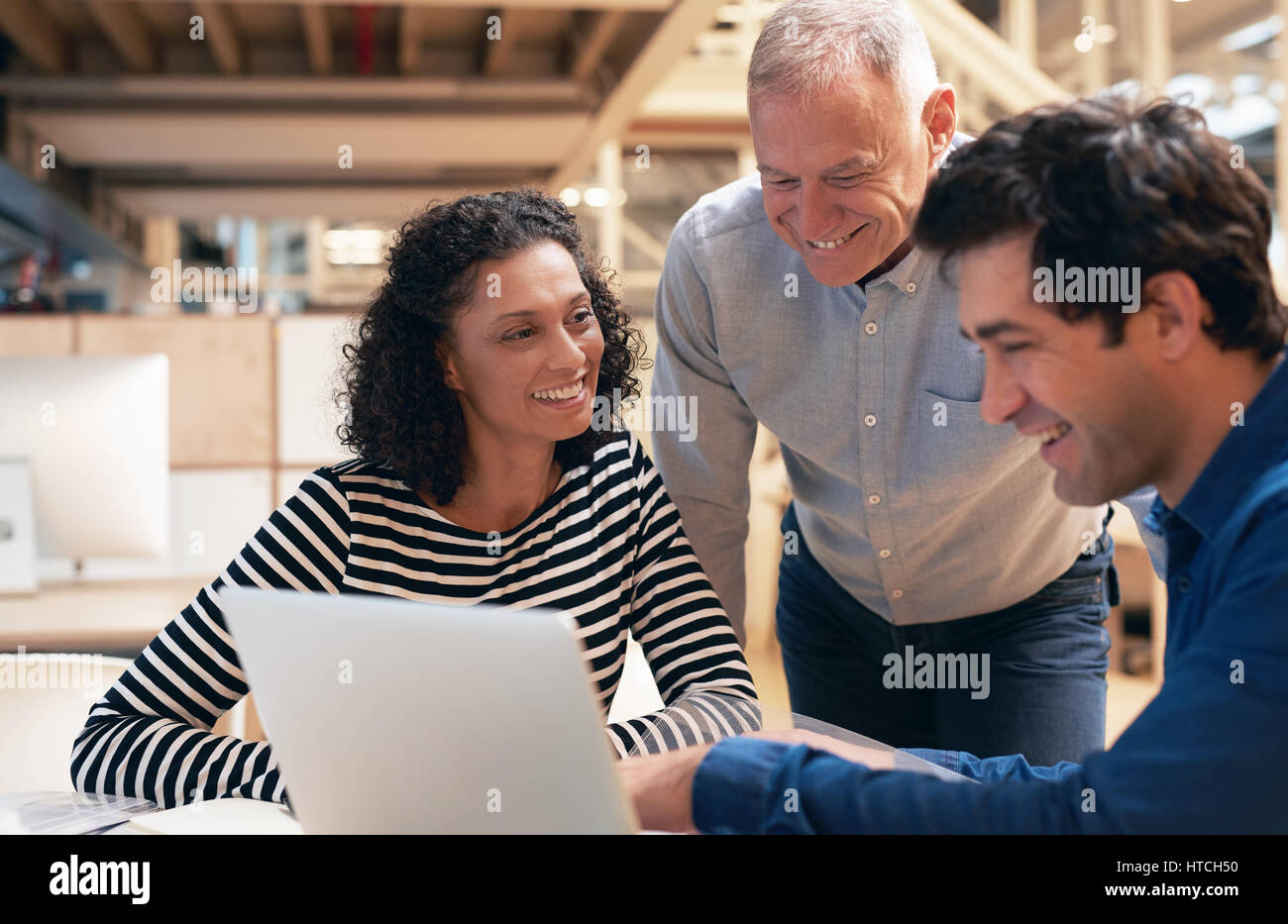 Smiling diverse businesspeople having discussion hi-res stock ...