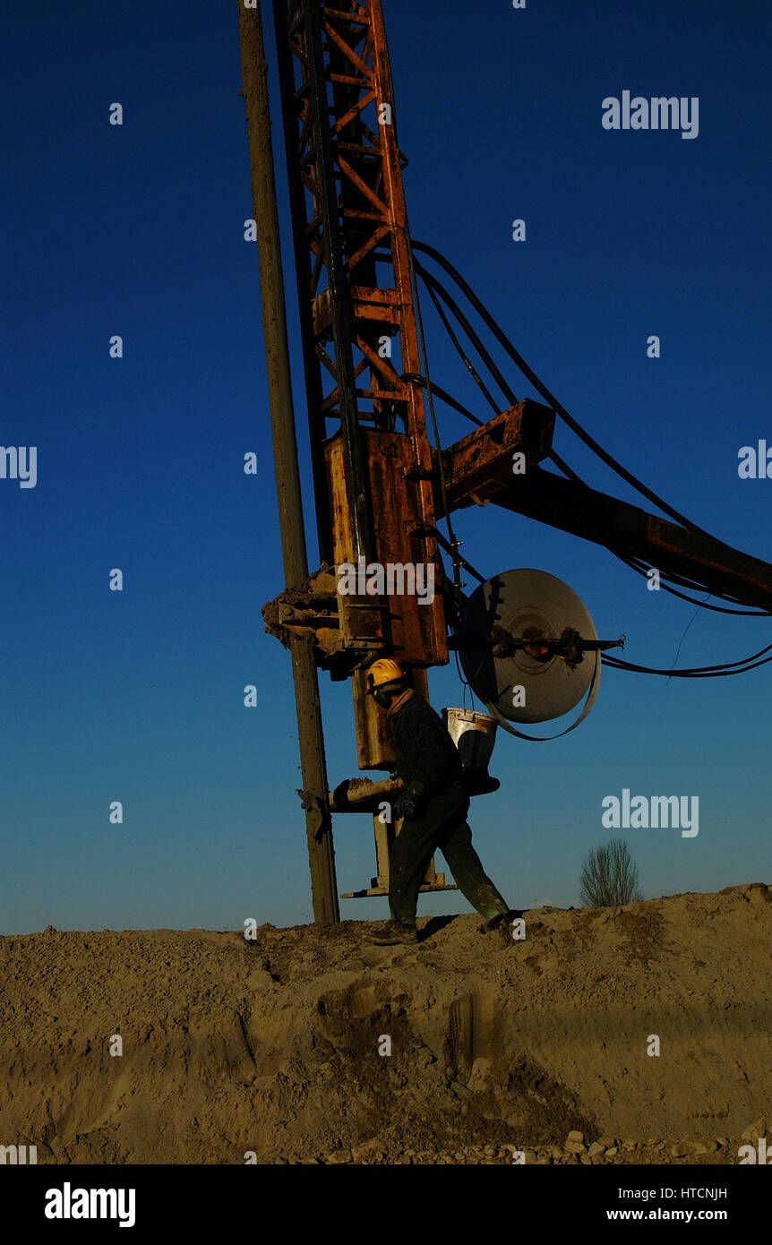 workers at work on site with caterpillar construction equipment Stock ...
