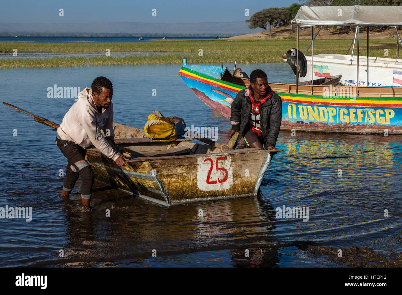 Two african men fishing hi-res stock photography and images - Alamy