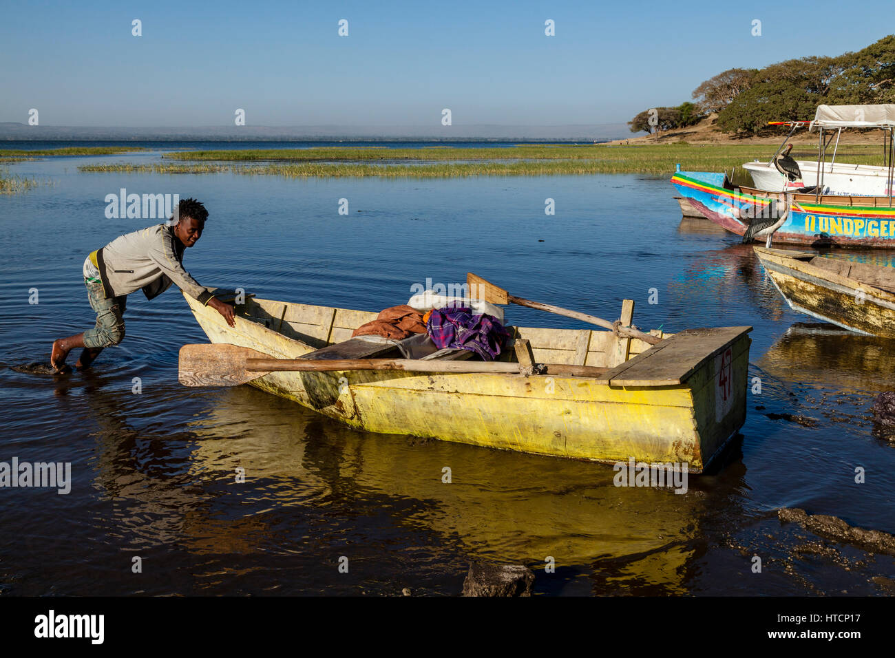 A Local Fisherman Returns To The 'Fish Market' On The Shores Of Lake ...