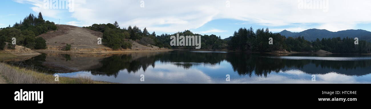 Lake Lagunitas in Marin County with smooth clouds and a reflection over ...