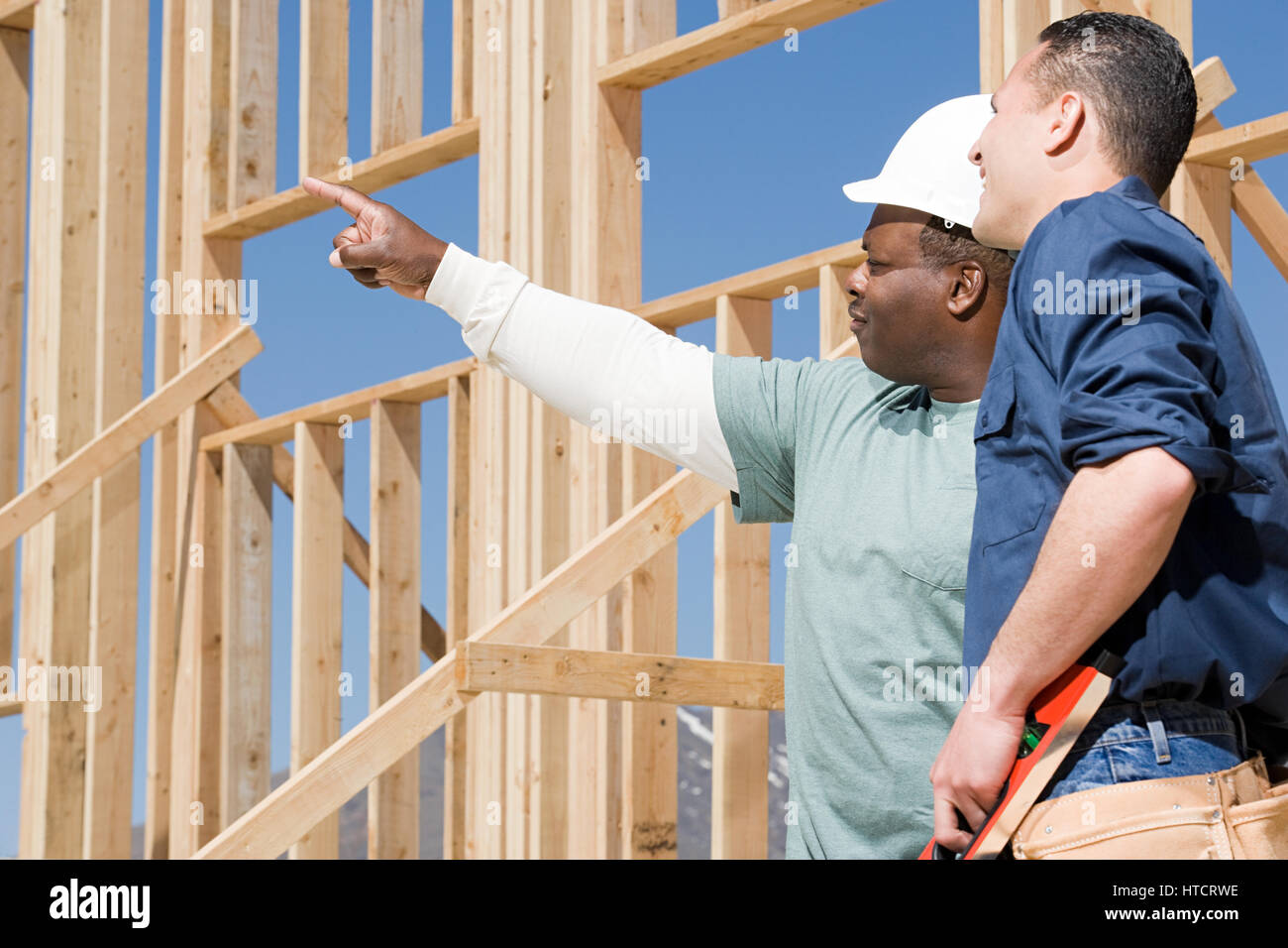 Builders on a construction site Stock Photo - Alamy