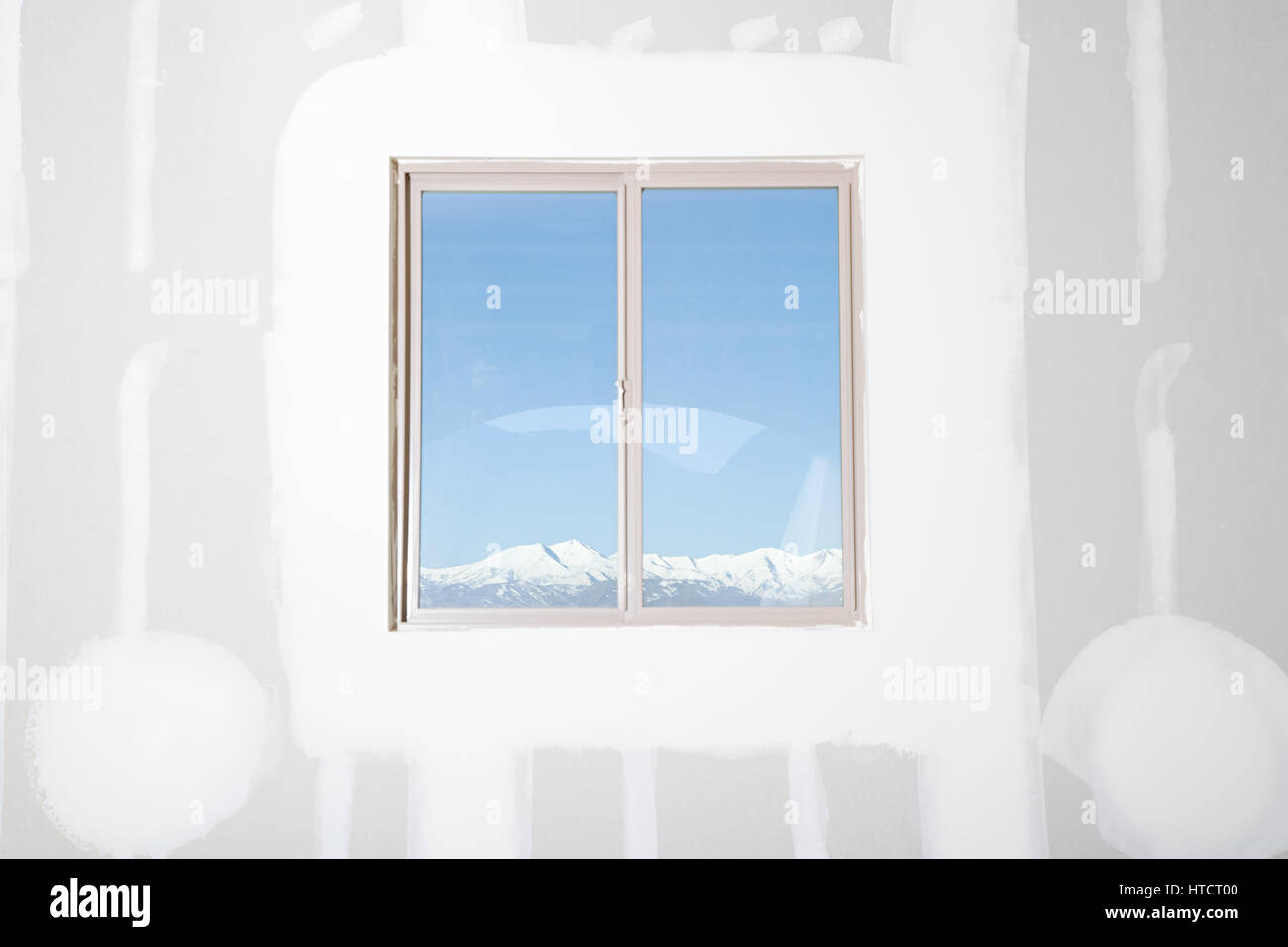 A view of mountains through a window Stock Photo - Alamy