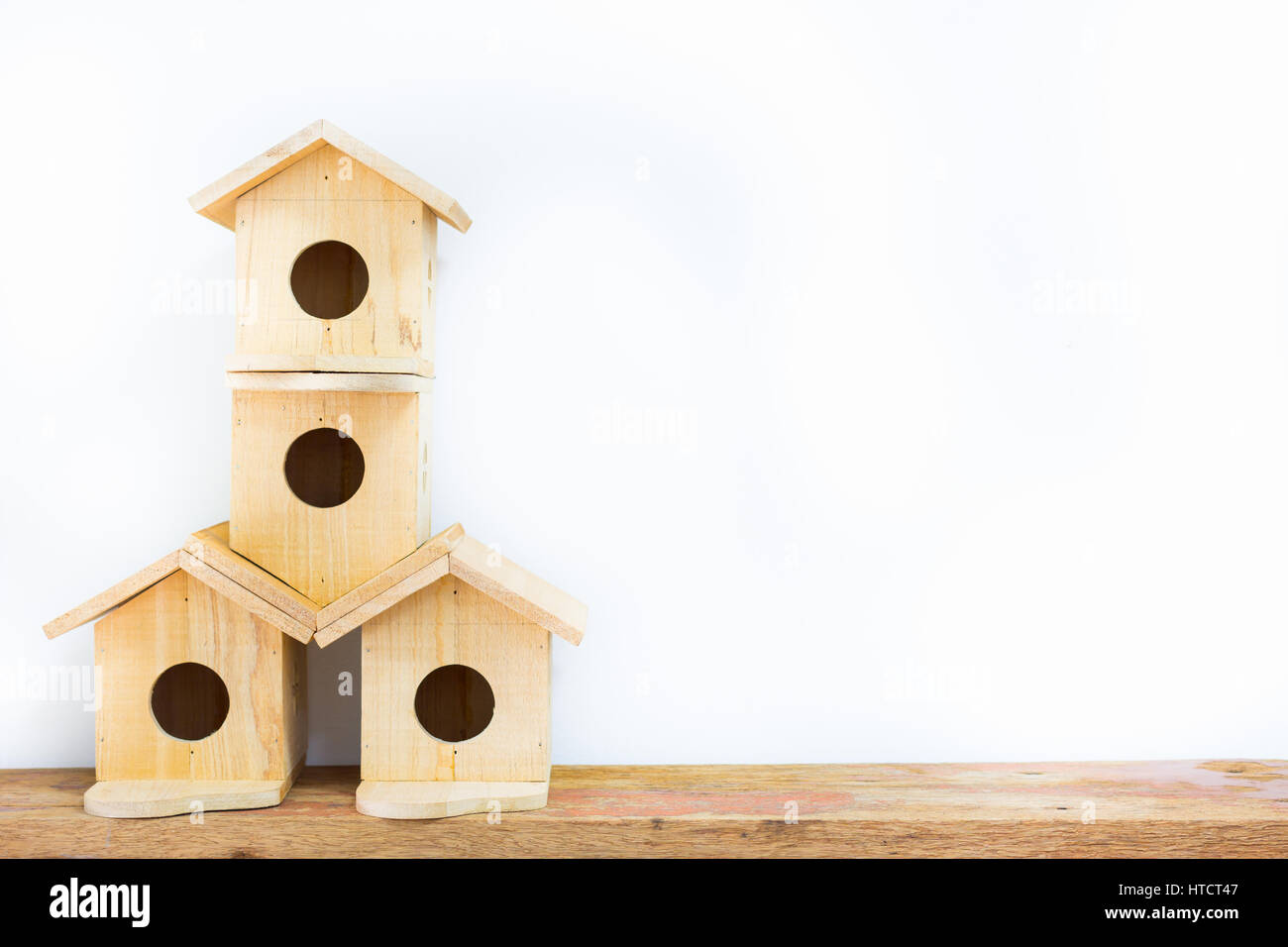 Wooden bird houses on old wood white background Stock Photo - Alamy