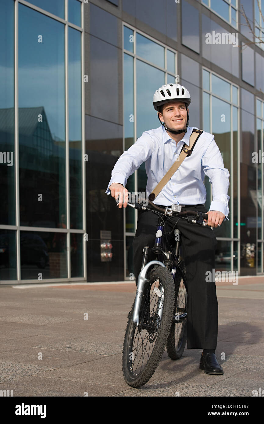Office worker on bicycle Stock Photo - Alamy