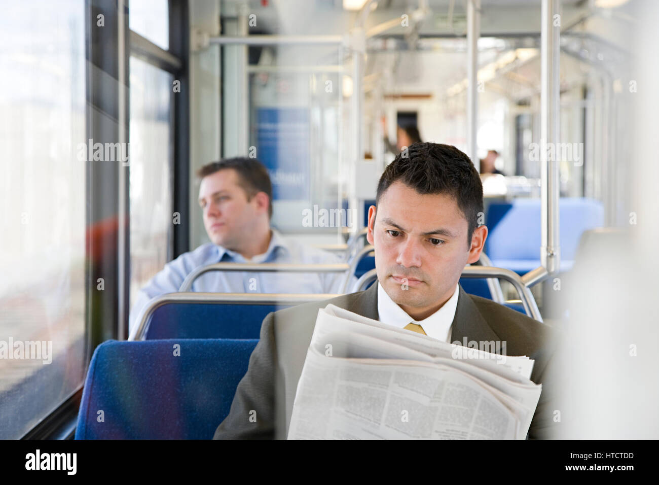 Reading newspaper on train hi-res stock photography and images - Alamy