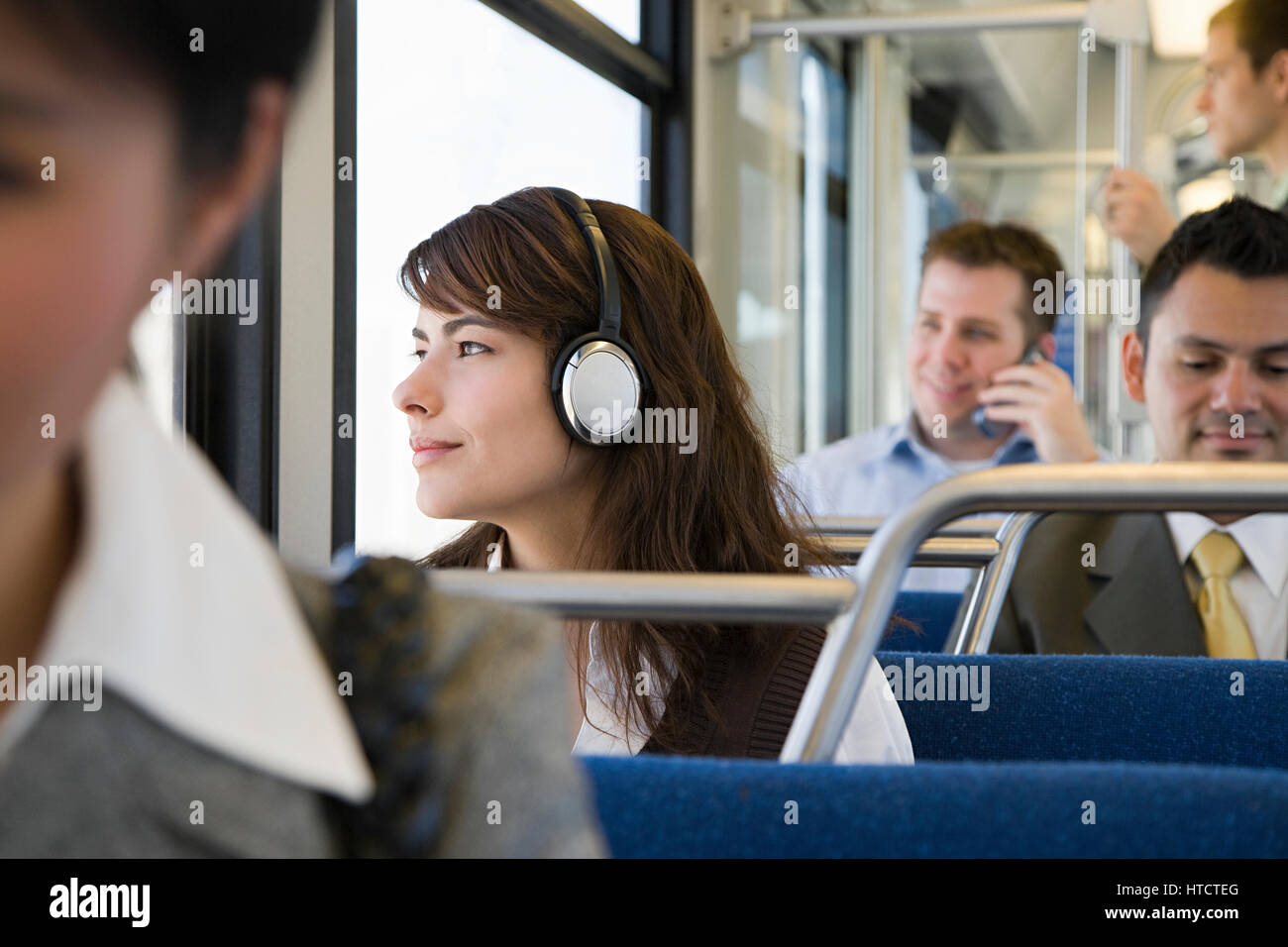 Commuters on train Stock Photo - Alamy