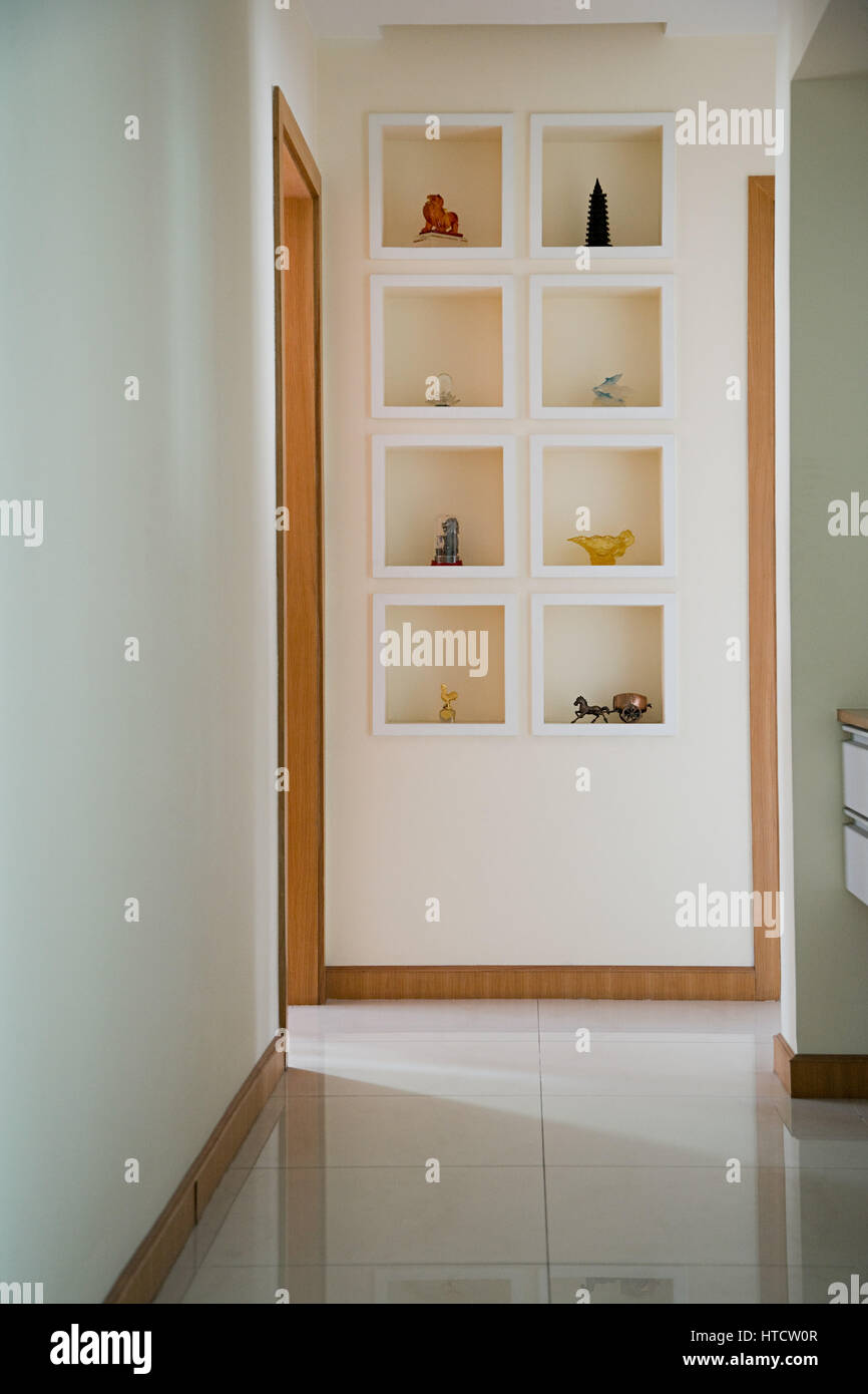 Ornaments on shelves in a corridor Stock Photo - Alamy