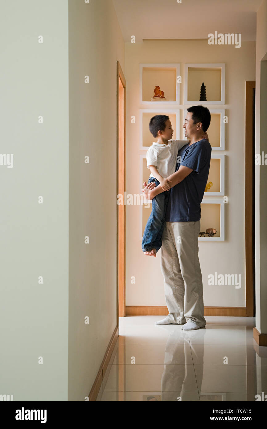 Father holding his son Stock Photo - Alamy