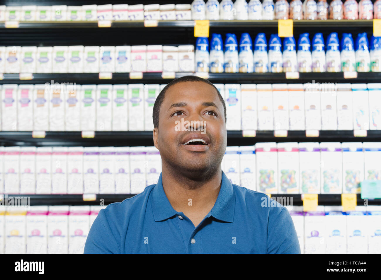 man shopping in a supermarket Stock Photo - Alamy