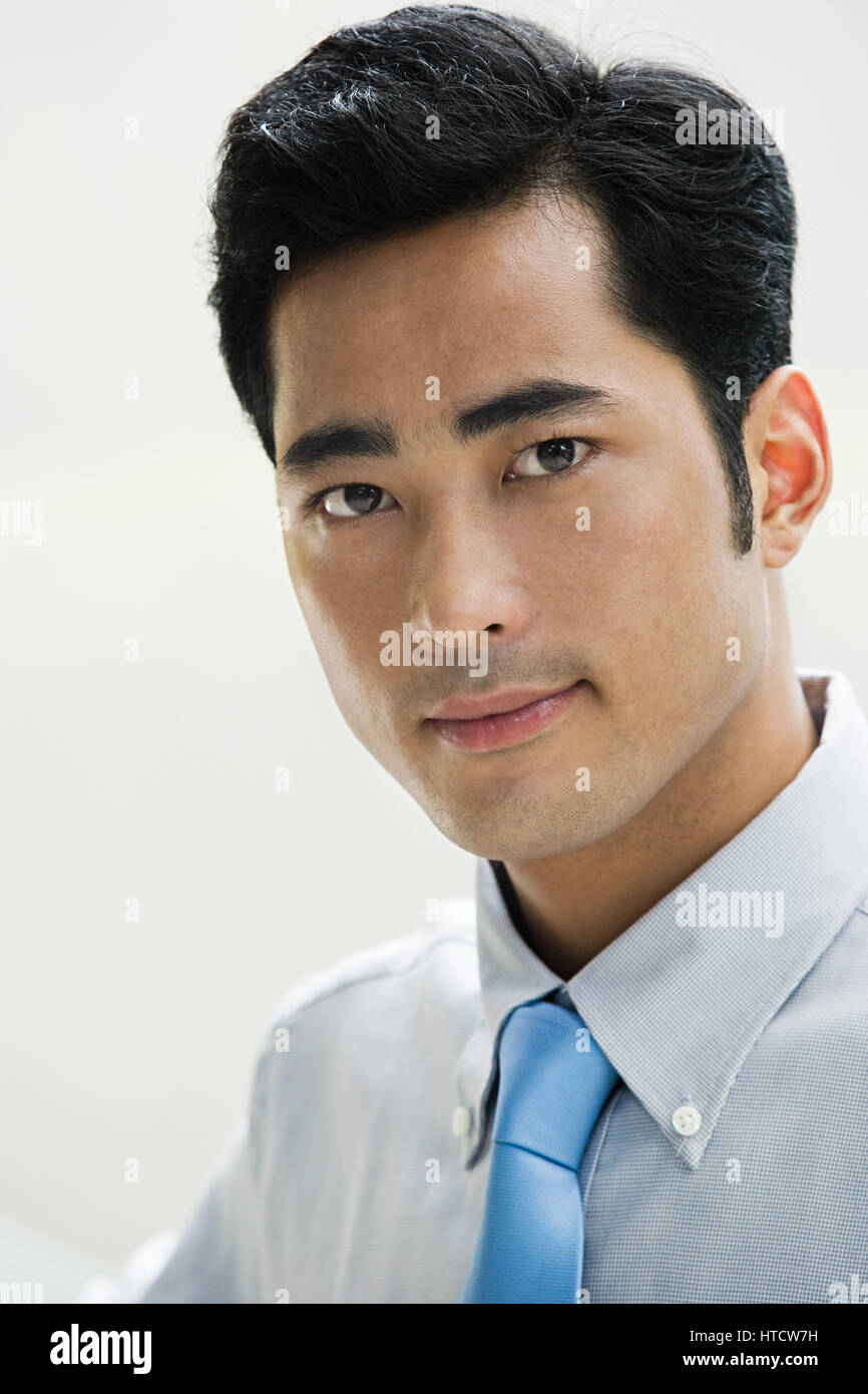 Portrait of a young Chinese businessman Stock Photo - Alamy