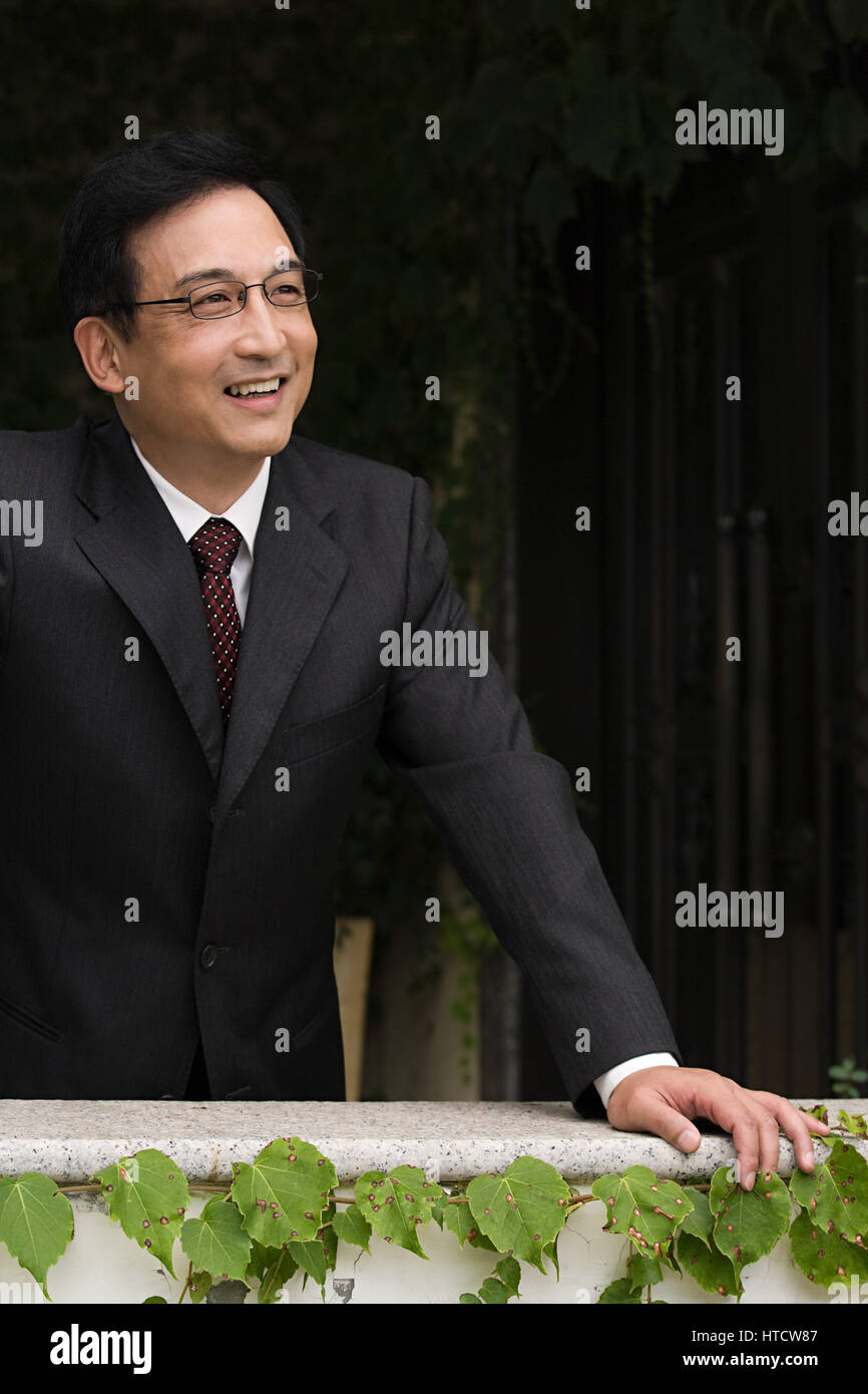 Smiling Chinese businessman Stock Photo - Alamy