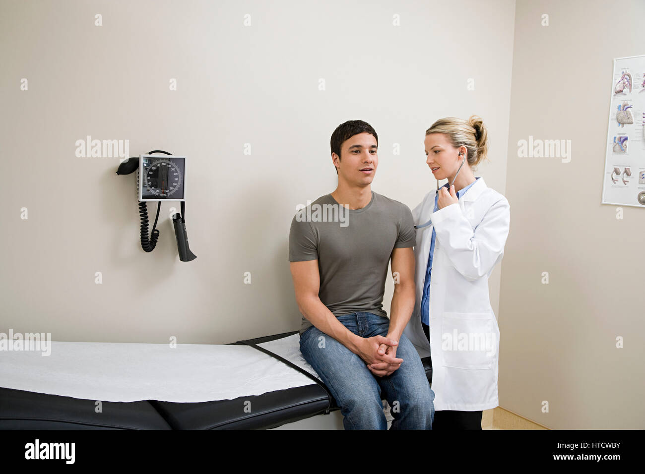 Doctor examining patient Stock Photo - Alamy