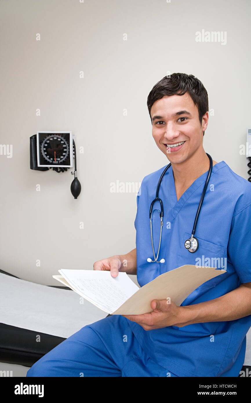 Doctor with medical records Stock Photo - Alamy