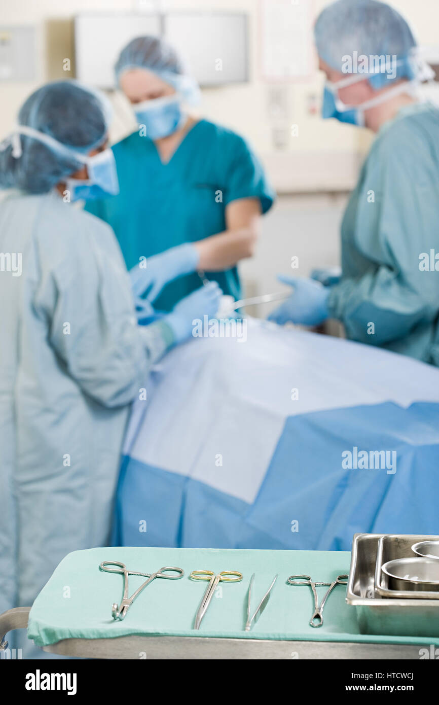 Surgeons performing operation Stock Photo - Alamy