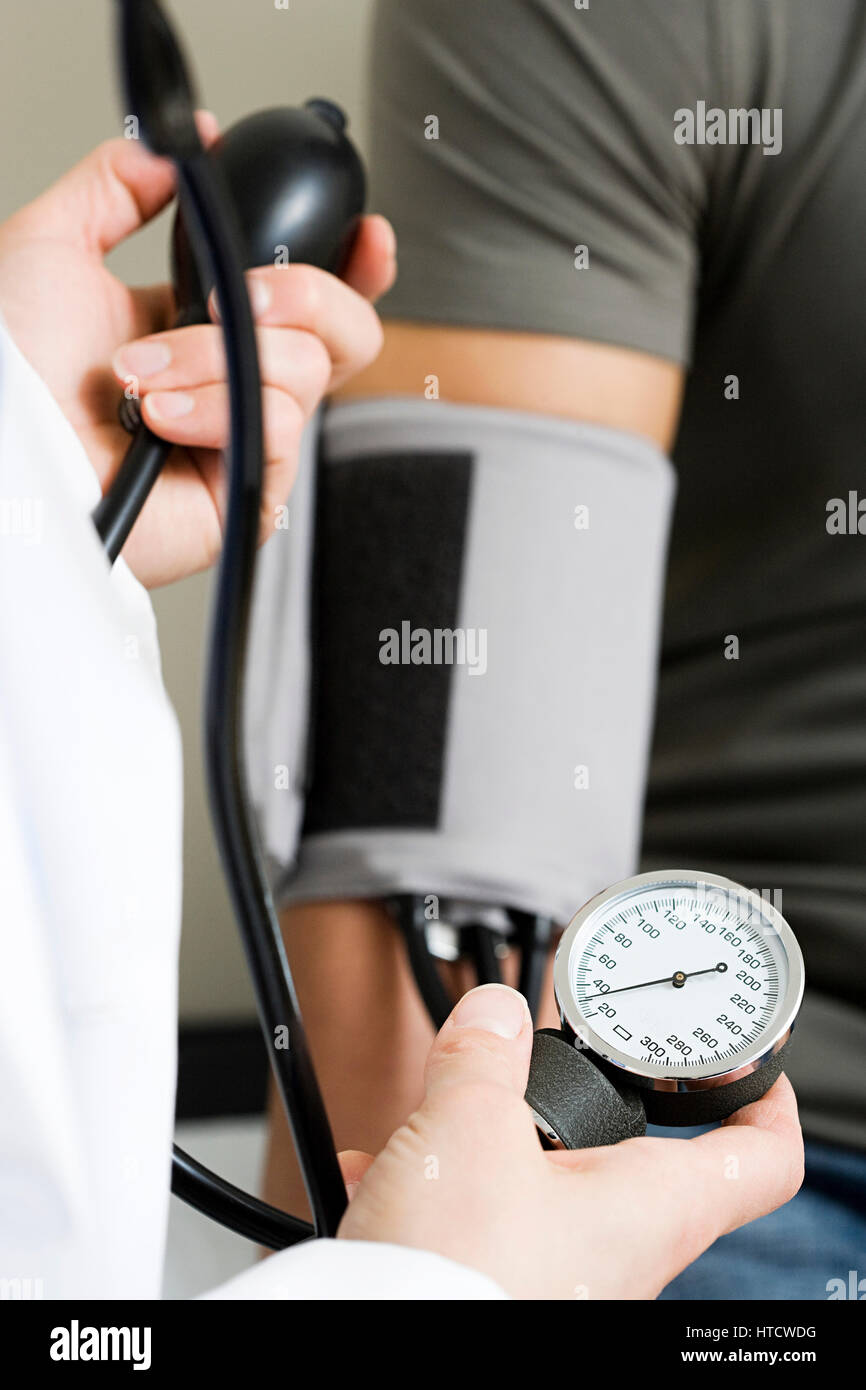 Taking blood pressure reading Stock Photo - Alamy