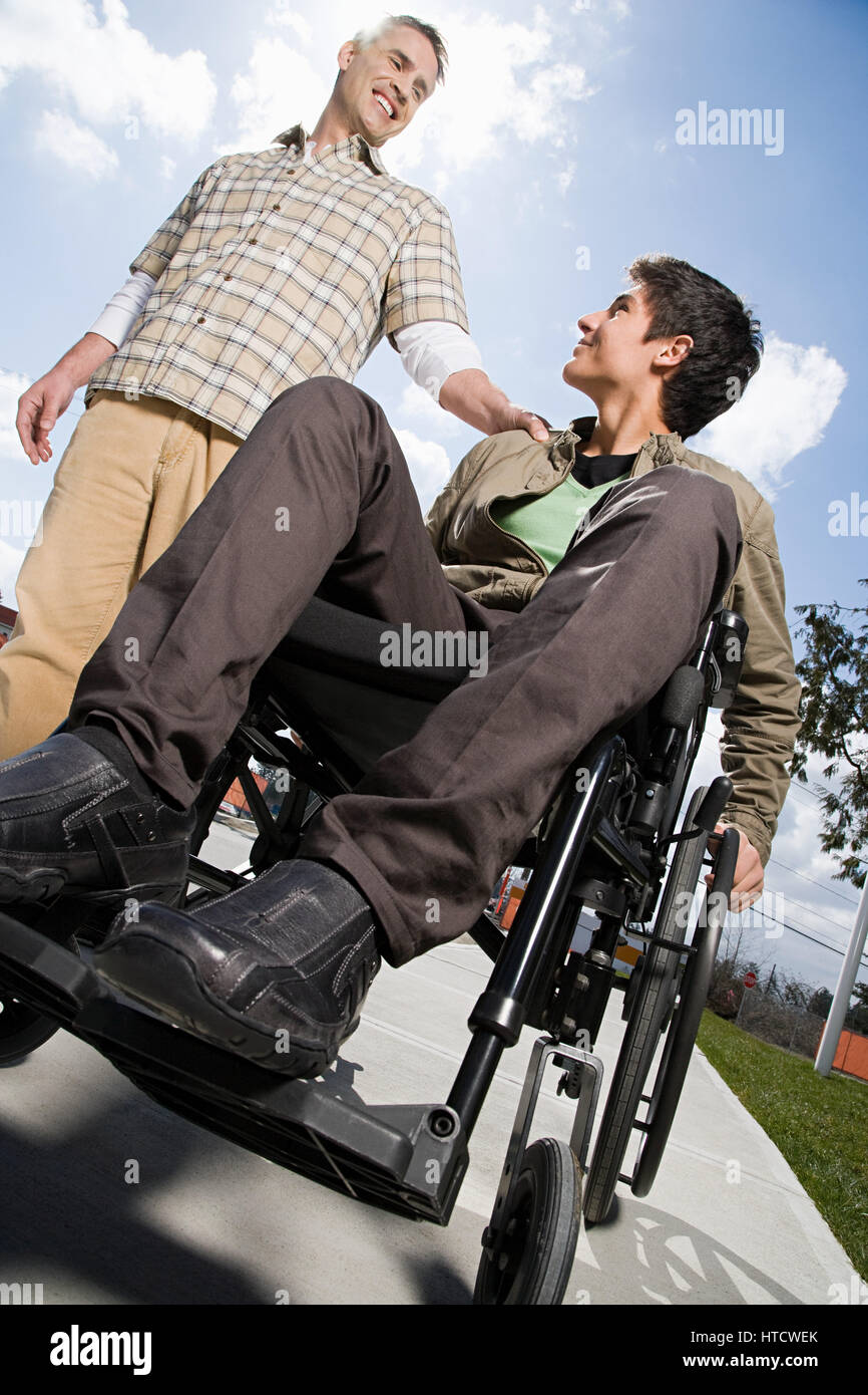 Father with disabled son Stock Photo - Alamy