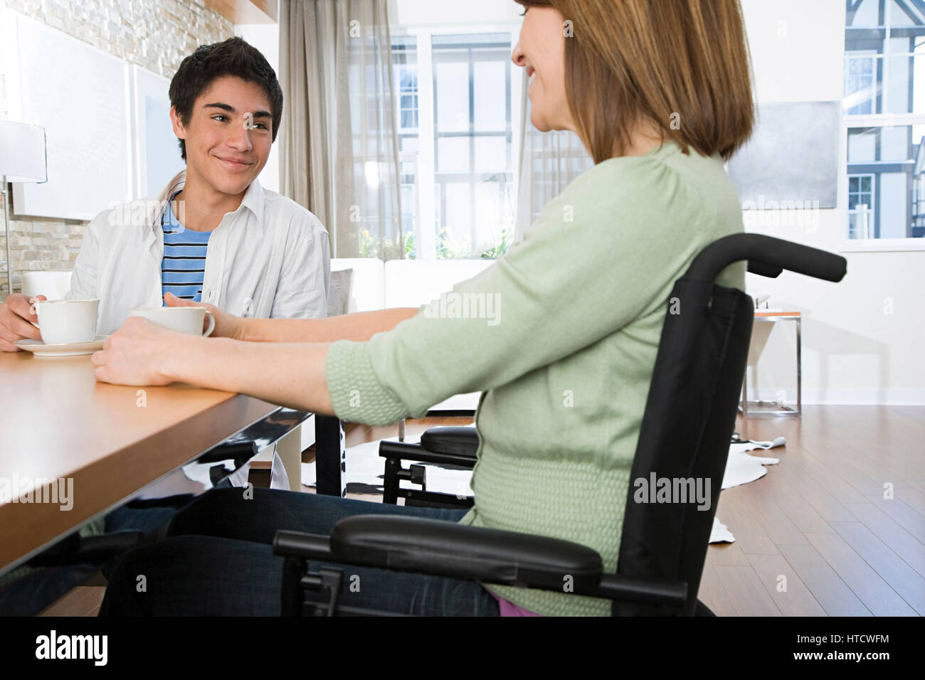 Disabled mother with son Stock Photo - Alamy