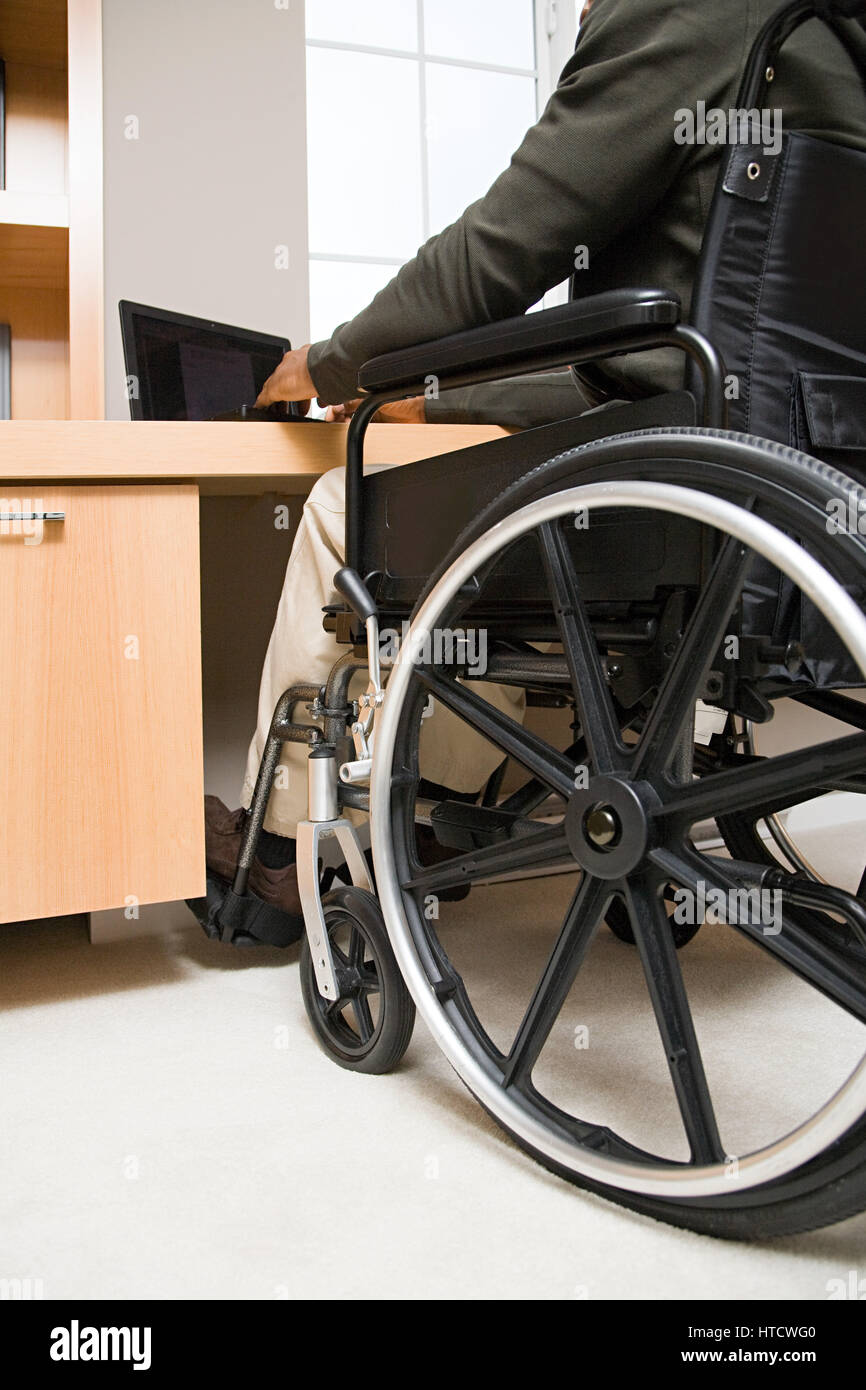 Rear view of a disabled man in a wheelchair Stock Photo - Alamy