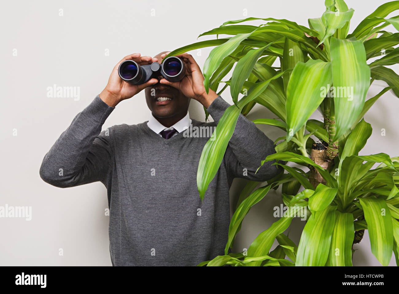 Businessman looking through binoculars Stock Photo - Alamy Businessman looking through binoculars Stock Photo - Alamy