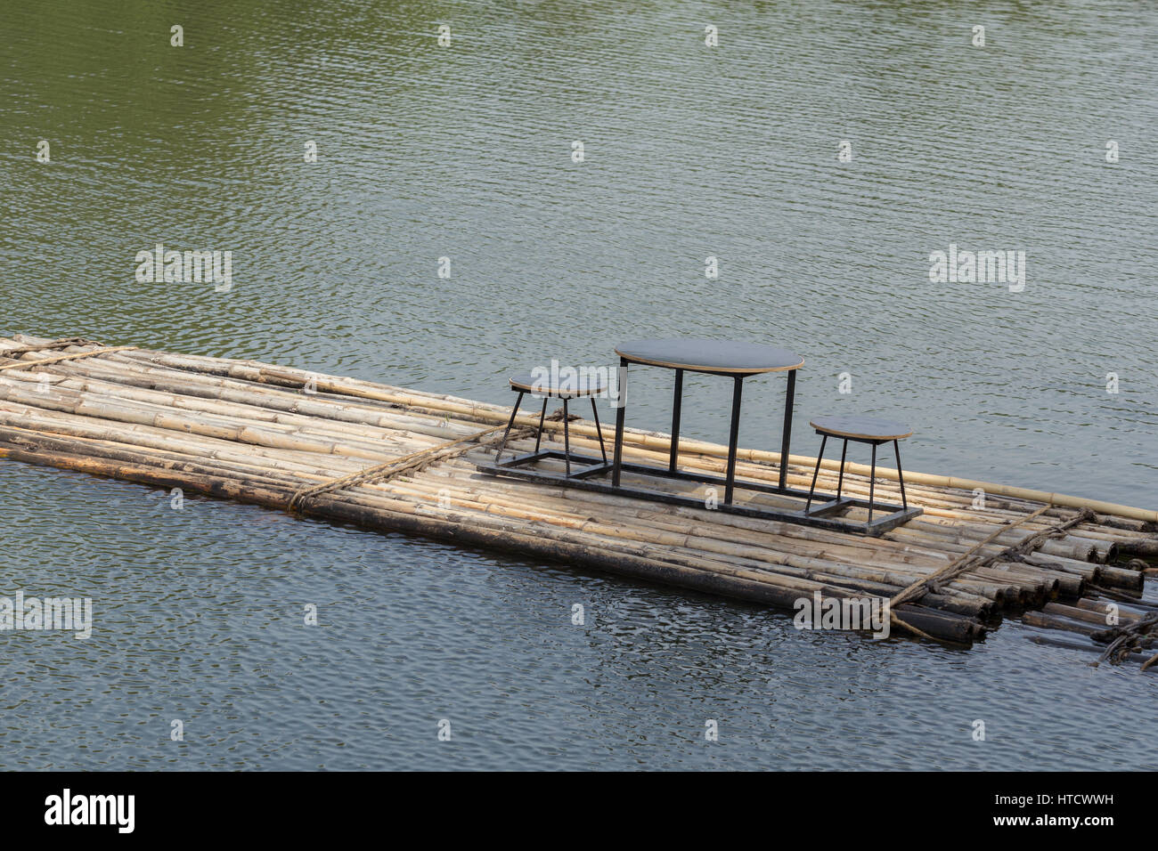 Bamboo rafts floating in the river and dining table and chair Stock ...