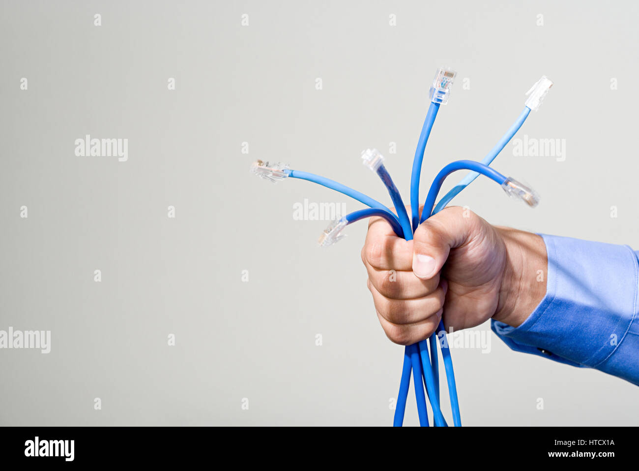 Man holding network cables Stock Photo - Alamy