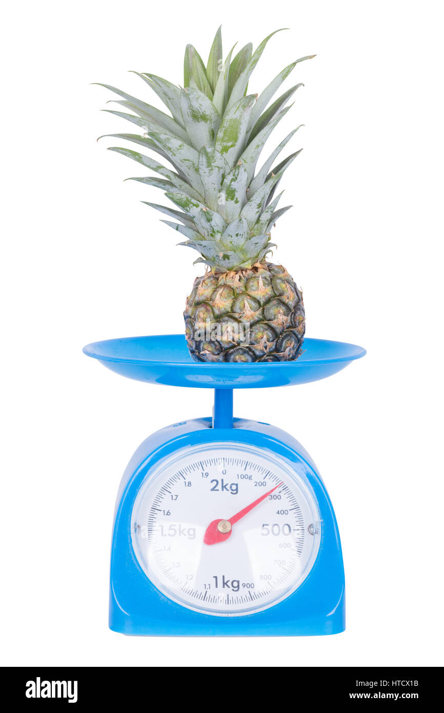 pineapple on kitchen scale isolated on white background (with clipping ...