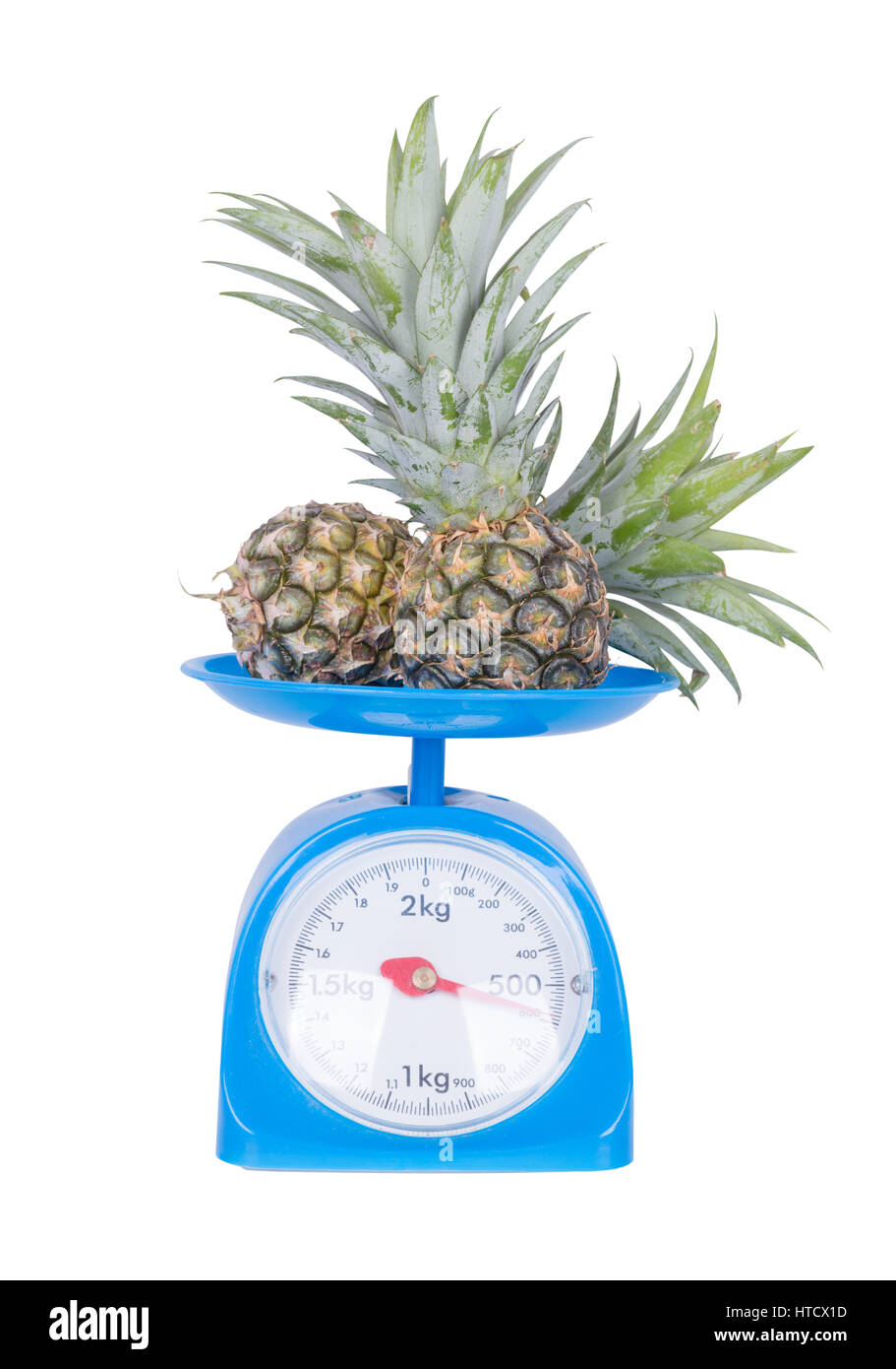 pineapple on kitchen scale isolated on white background (with clipping ...