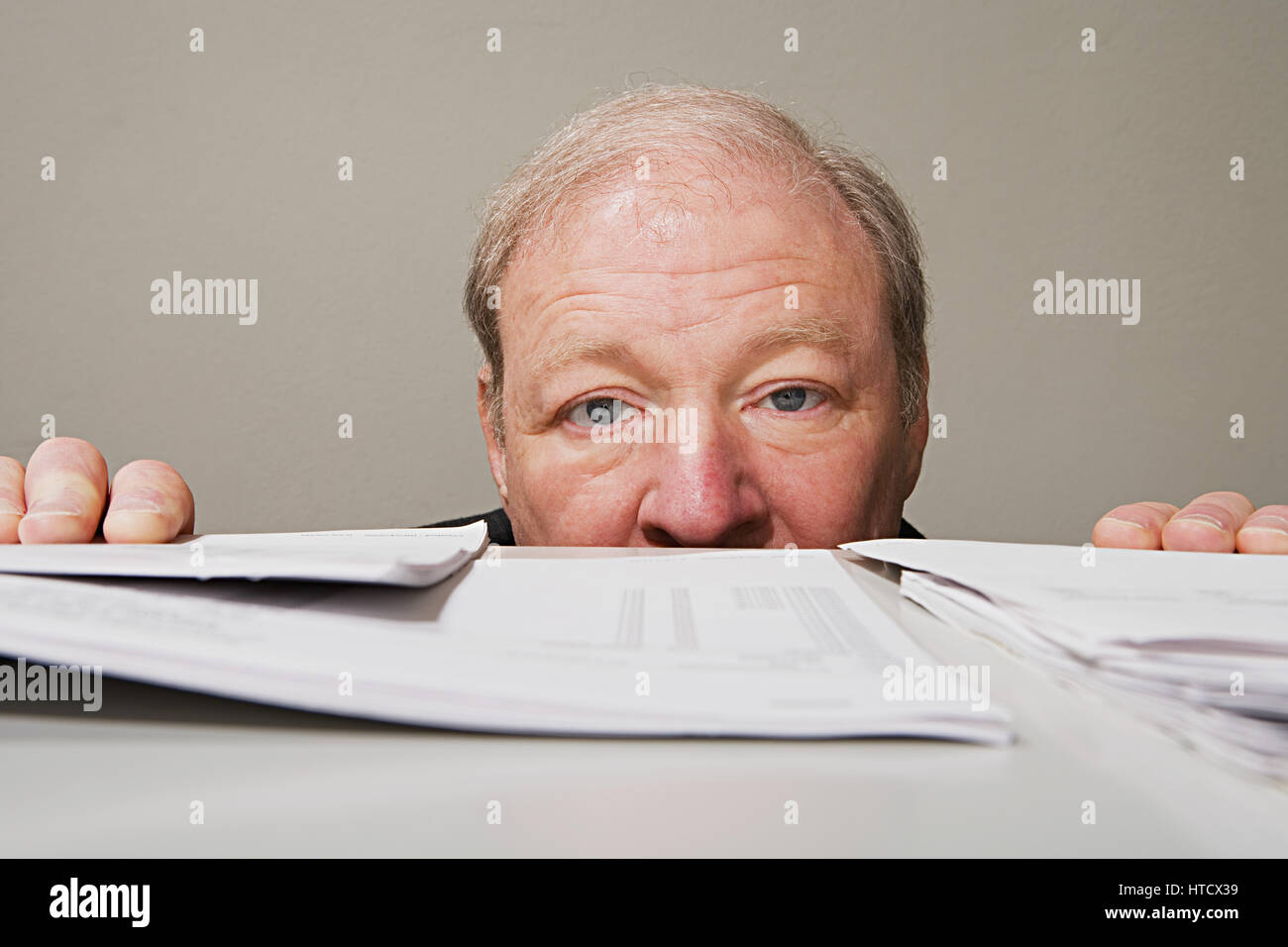 Man behind cabinet Stock Photo - Alamy