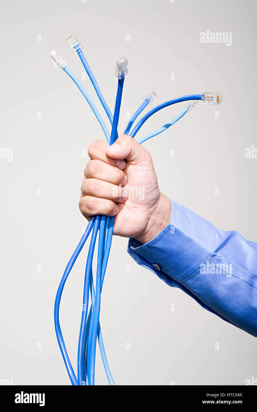 Man holding network cables Stock Photo - Alamy