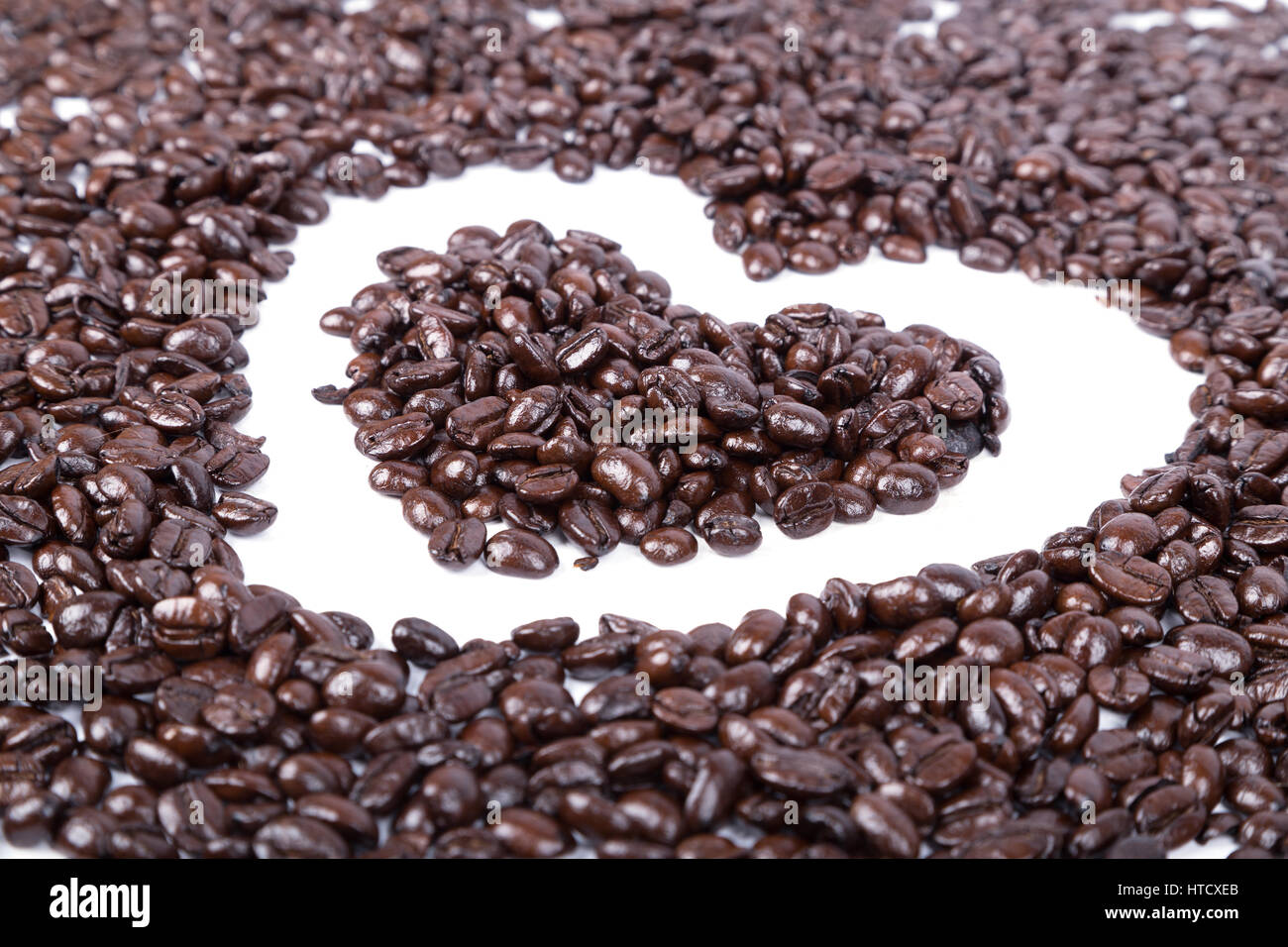 Coffee beans in shape of heart isolated on white background Stock Photo ...