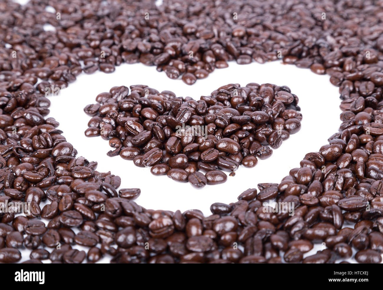 Coffee beans in shape of heart isolated on white background Stock Photo ...