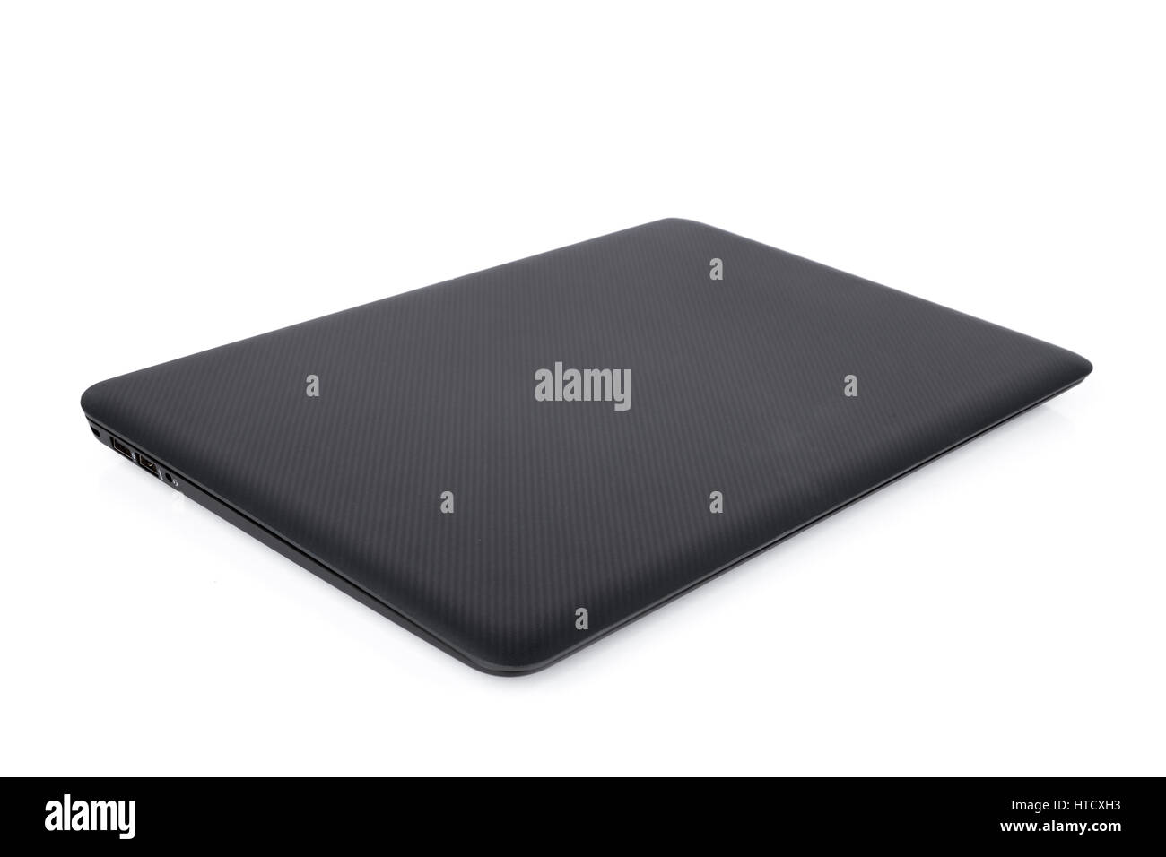 Closed laptop isolated on a white background Stock Photo - Alamy
