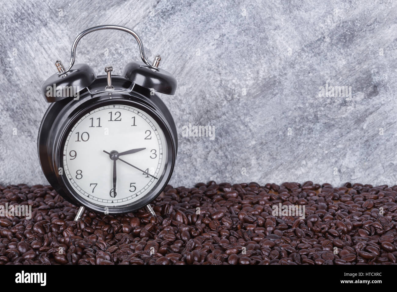 vintage clock and coffee beans (Coffee time concept) with concrete wall ...