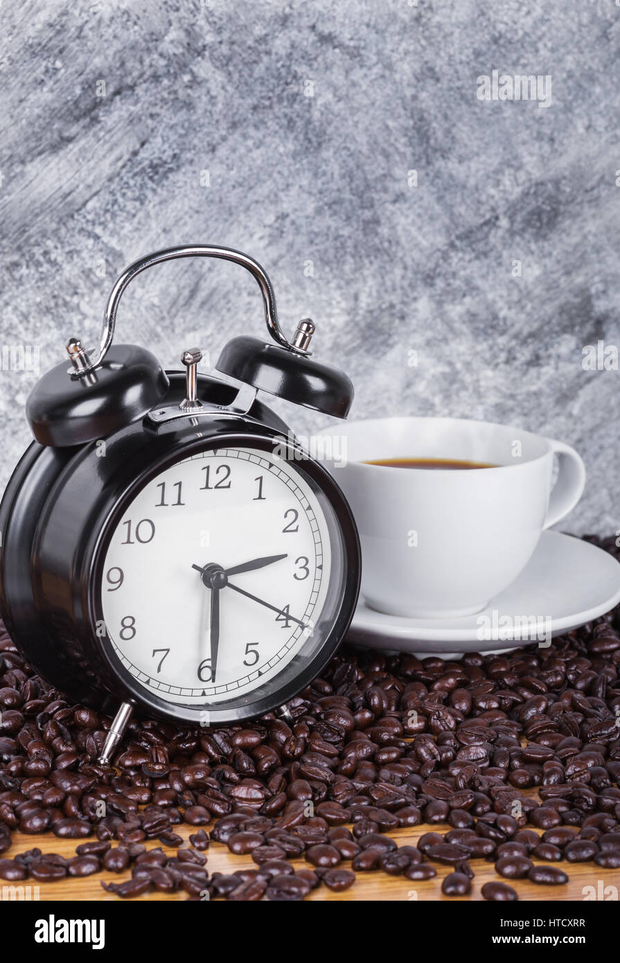 vintage clock and coffee in cup (Coffee time concept) with concrete ...
