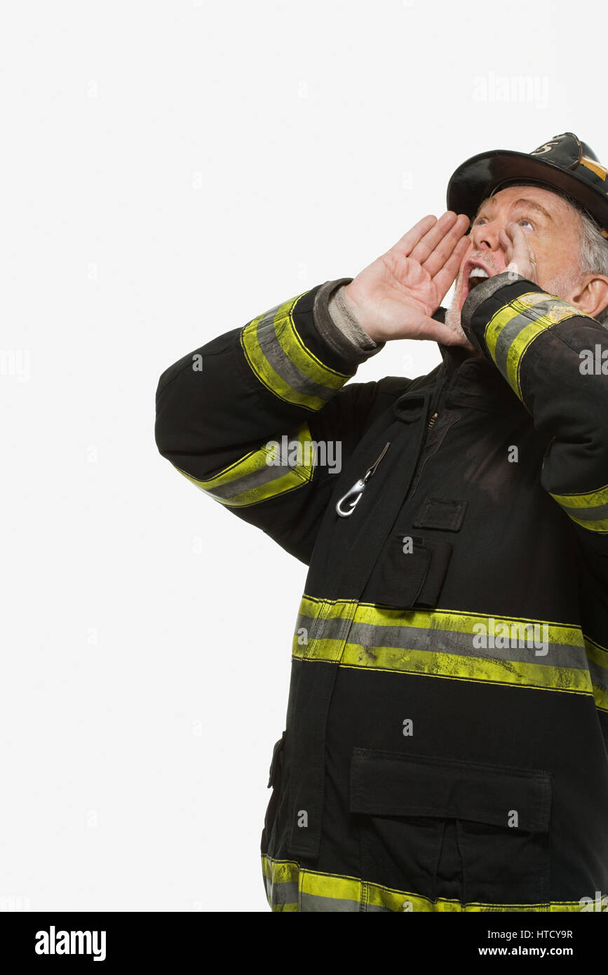 Portrait of a firefighter shouting Stock Photo - Alamy