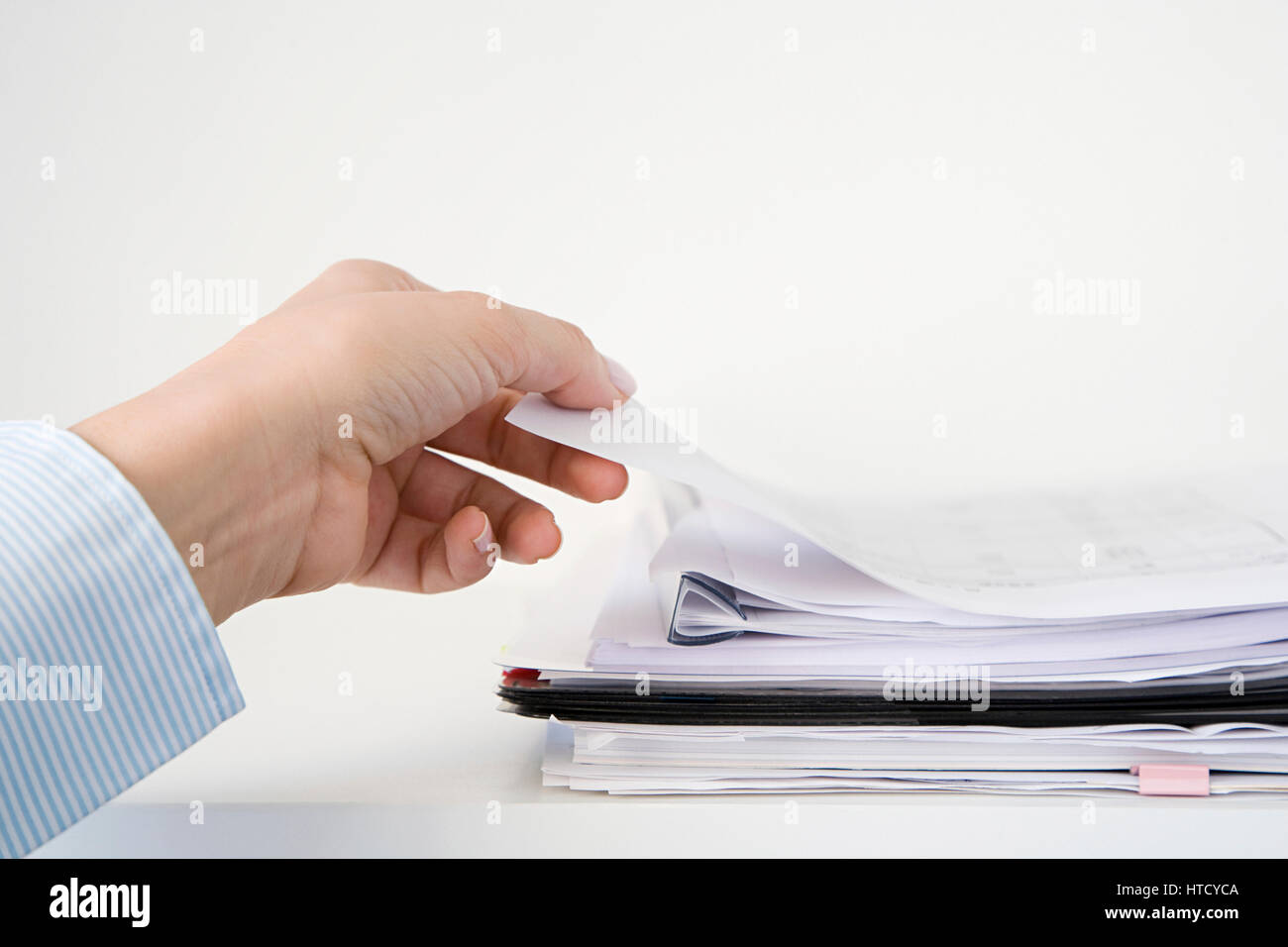 Person with paperwork Stock Photo - Alamy