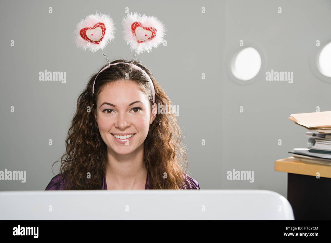 Office worker wearing deely bopper Stock Photo - Alamy