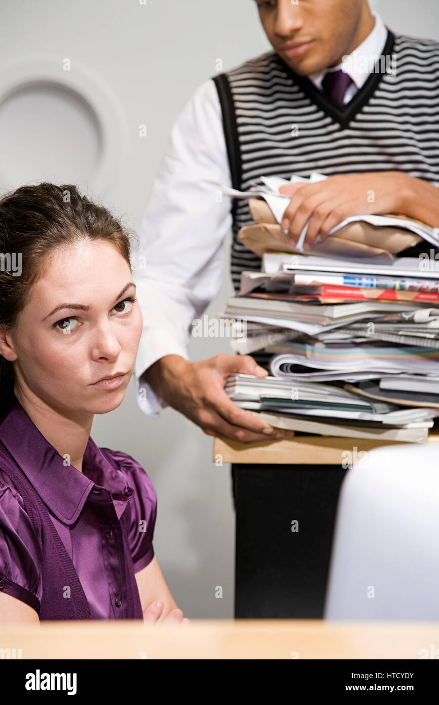 Office worker looking annoyed Stock Photo - Alamy