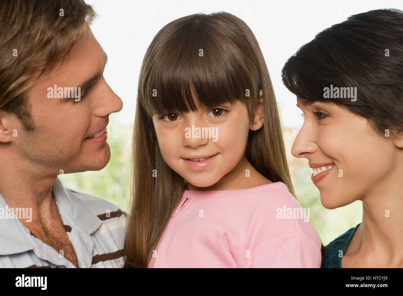 Girl with her parents Stock Photo - Alamy
