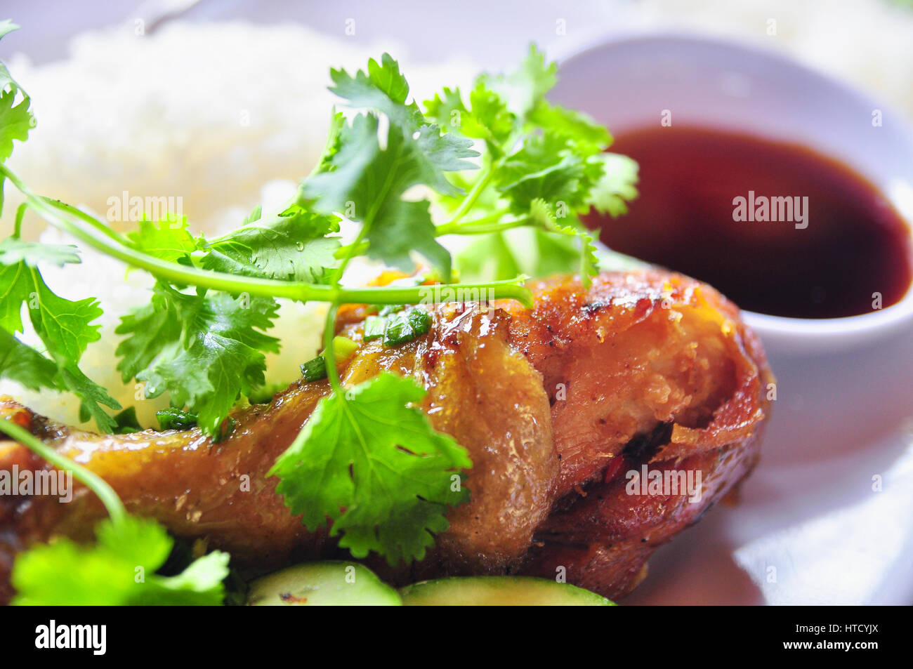 Vietnamese broken rice or com tam with fried chicken legs, pork and ...