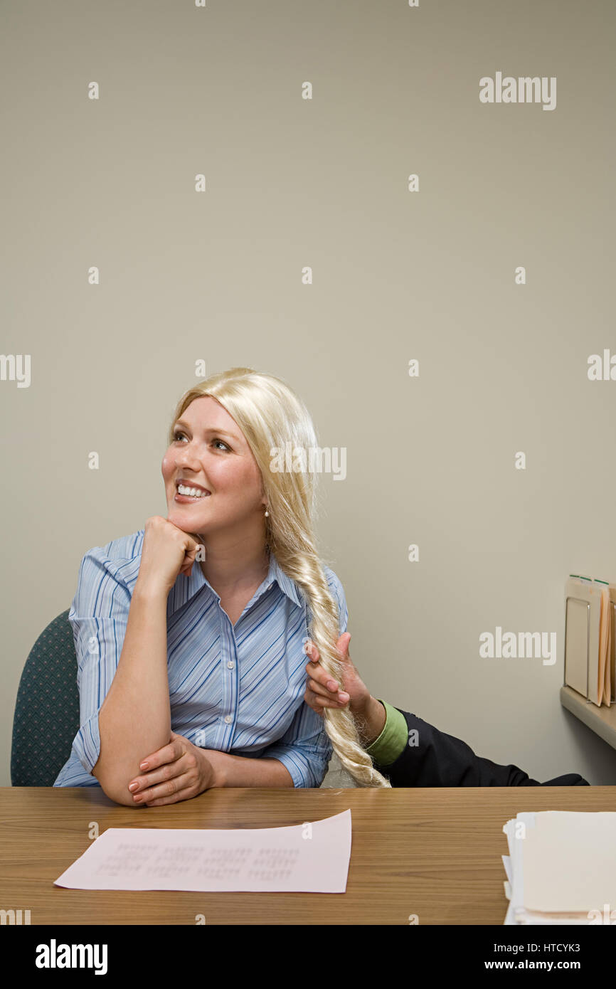 Man pulling a woman wig Stock Photo - Alamy