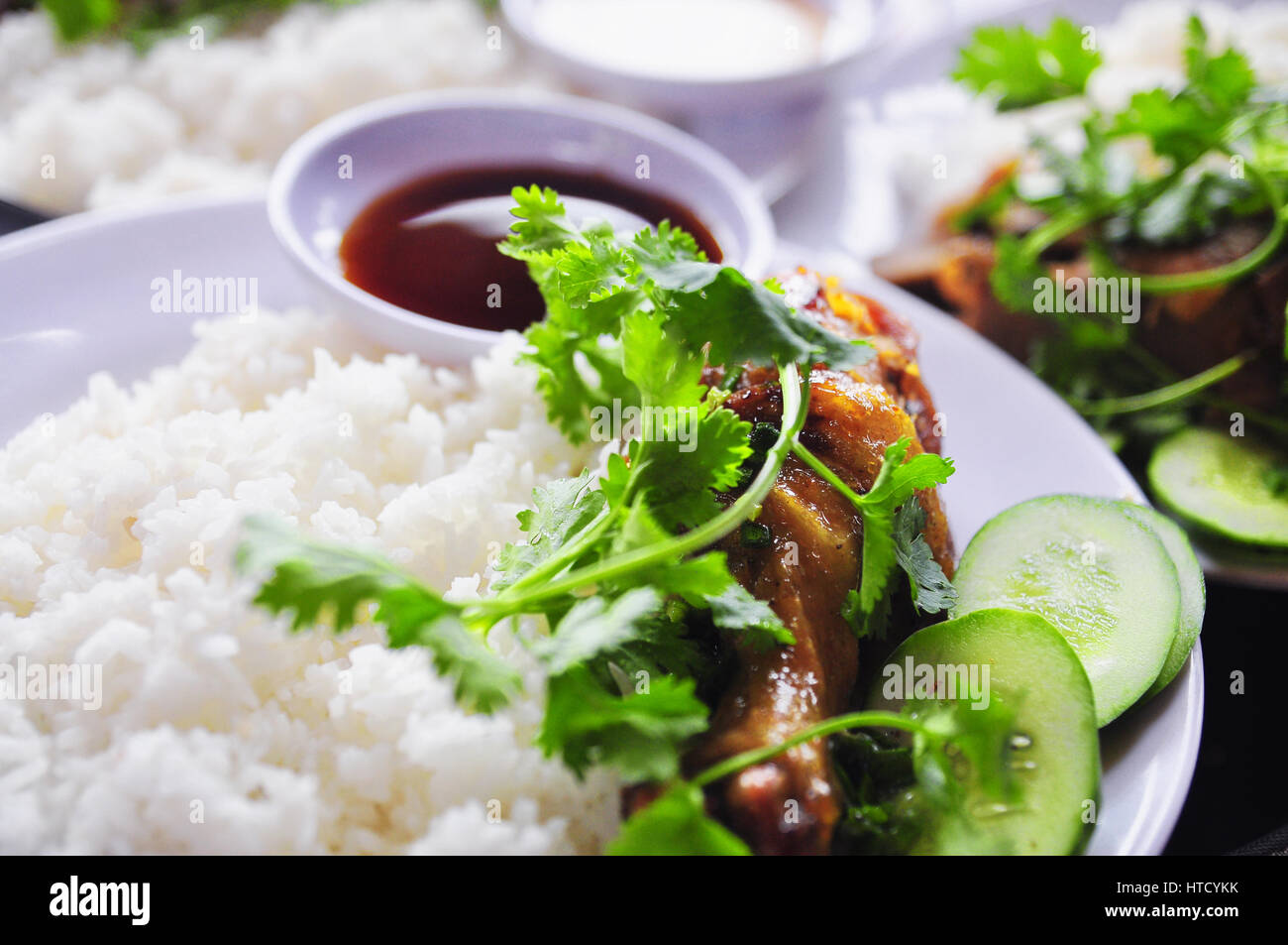 Vietnamese broken rice or com tam with fried chicken legs, pork and ...