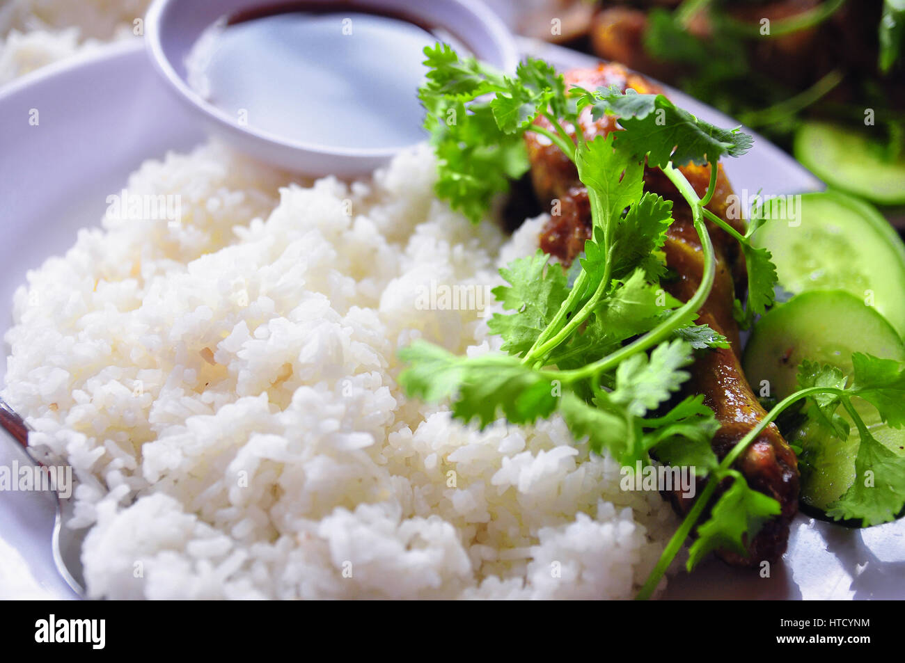 Vietnamese broken rice or com tam with fried chicken legs, pork and ...