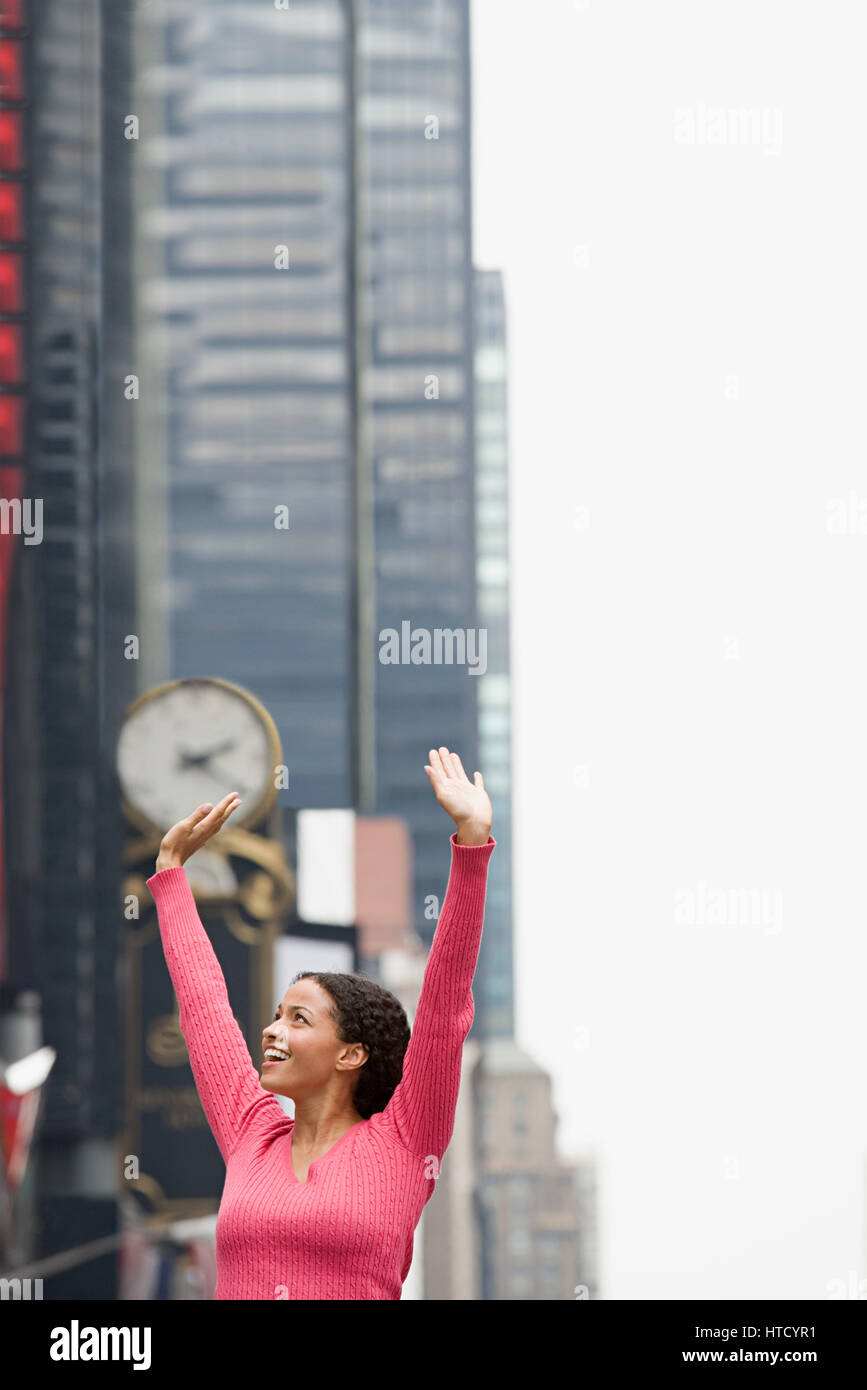 Woman with arms raised Stock Photo - Alamy
