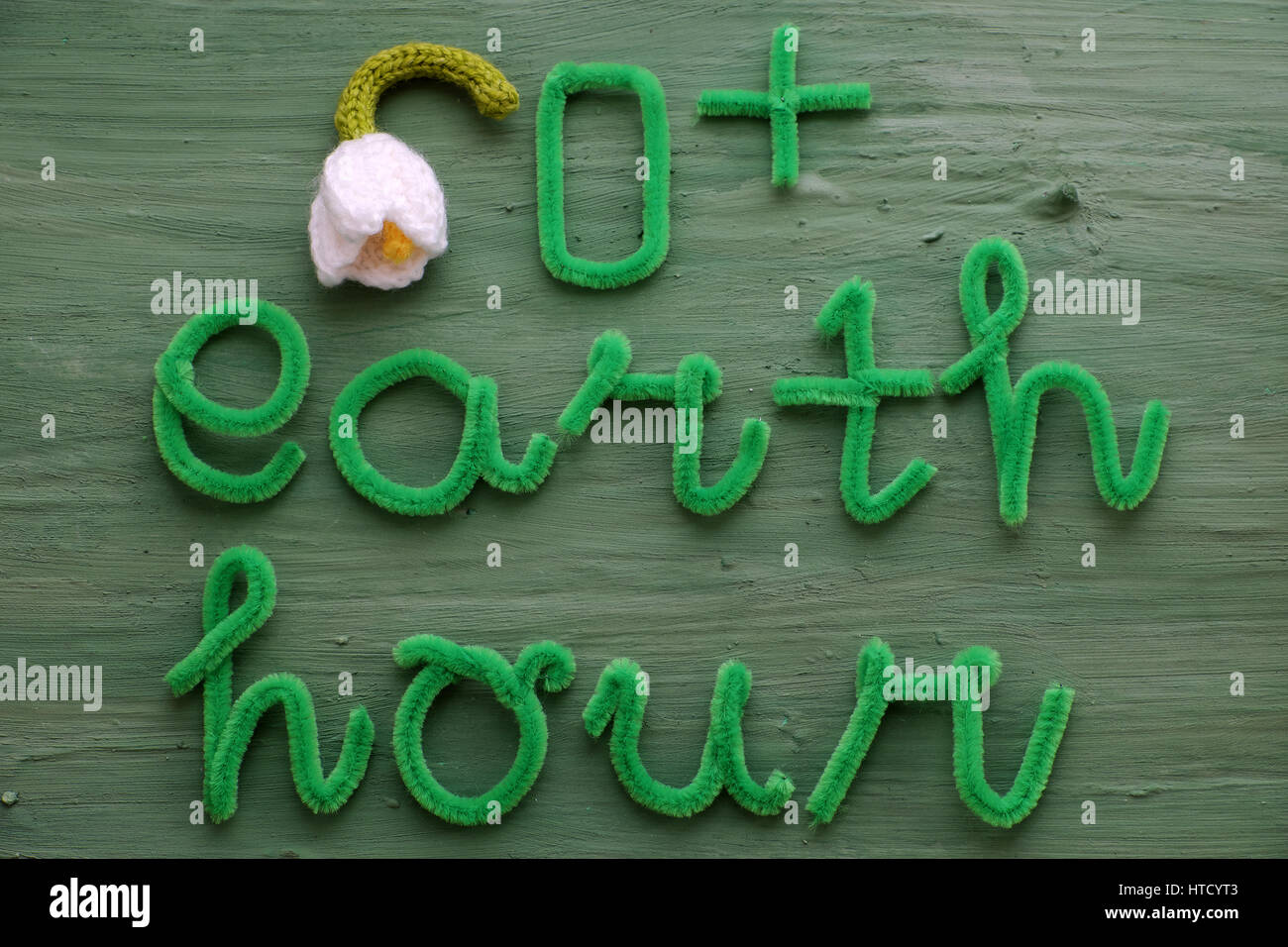 Earth hour message on green background, remind people give hand save ...