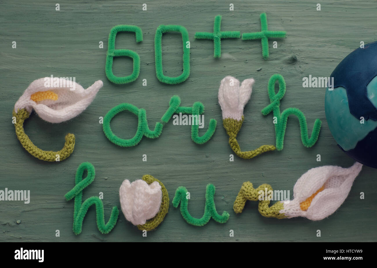 Earth hour message on green background, remind people give hand save ...