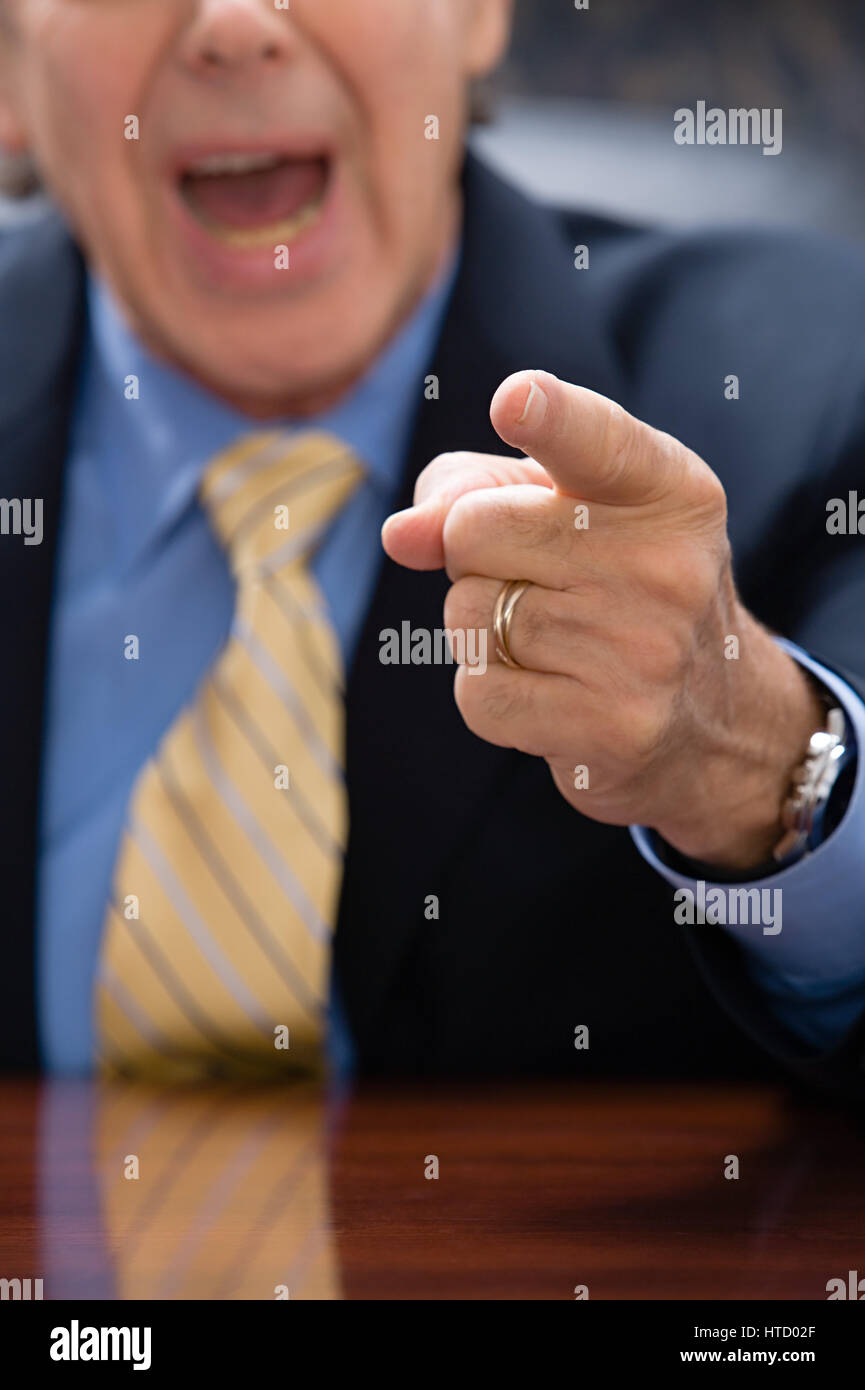 Strict businessman pointing finger hi-res stock photography and images ...